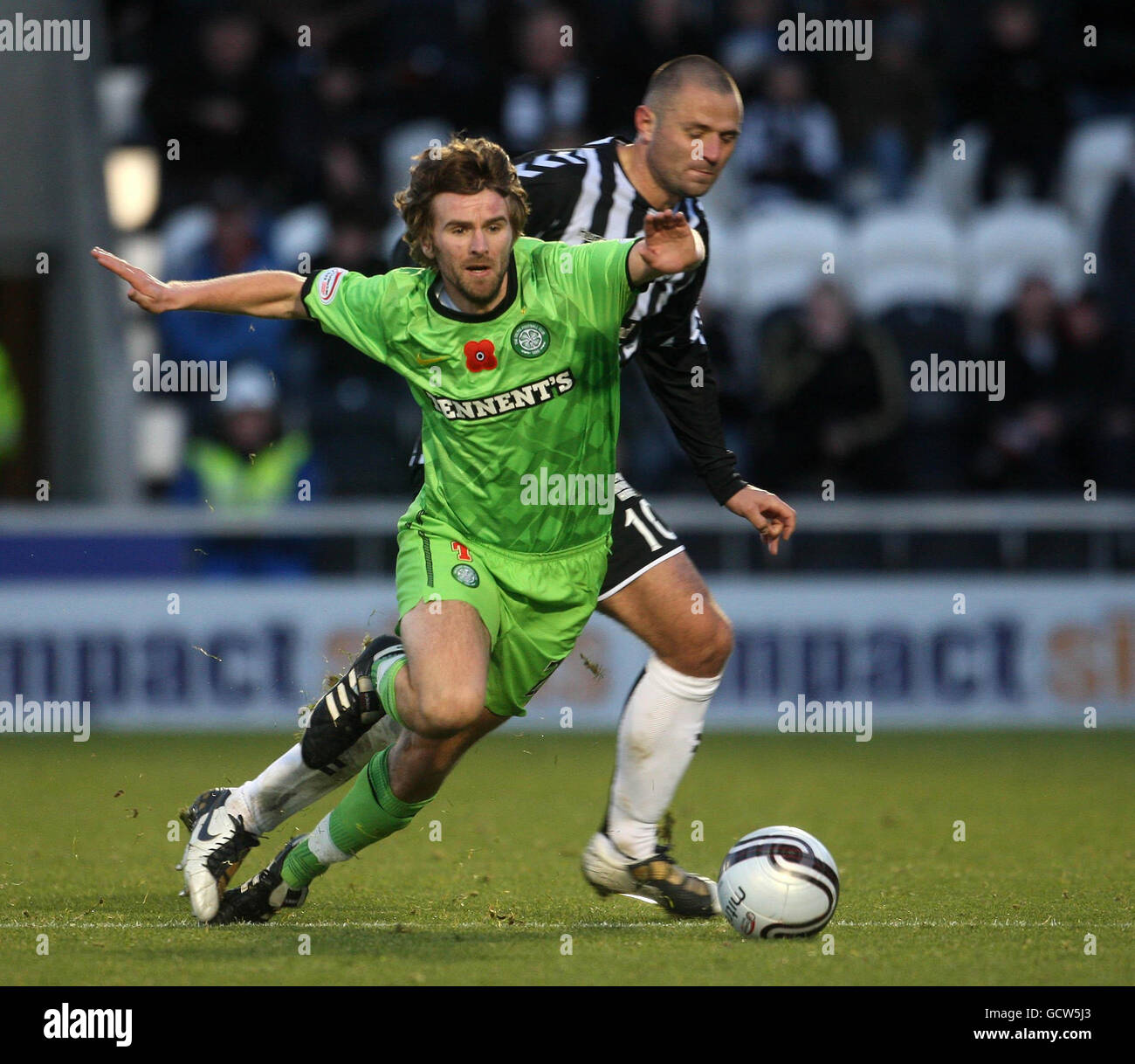 Celtic's Paddy McCourt (left) and St Mirren's Michael Higdon in action ...