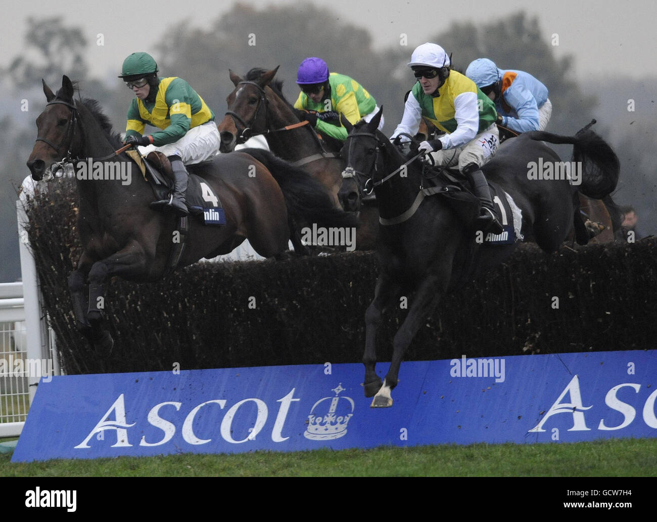 Jockey Tony McCoy, riding Albertas Run (right) before falling during ...