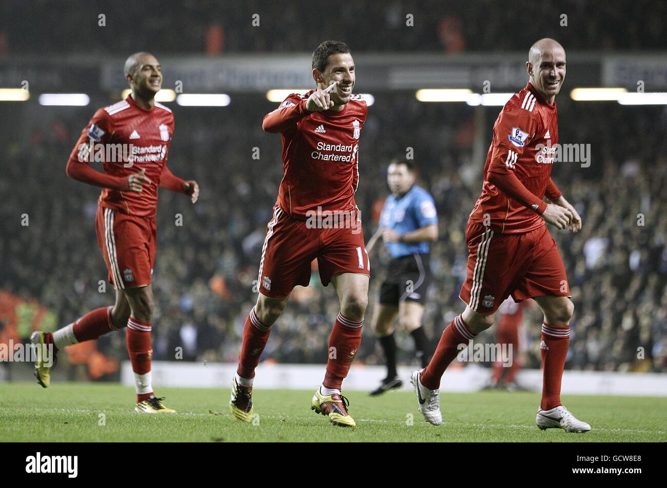 Liverpool's Rodriguez Maxi (centre) celebrates scoring their third goal ...