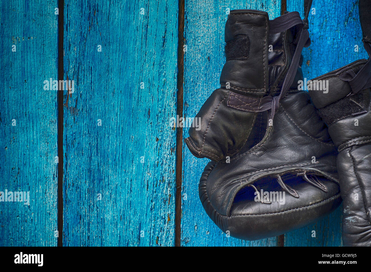 Hanging boxing gloves black background hi-res stock photography and ...