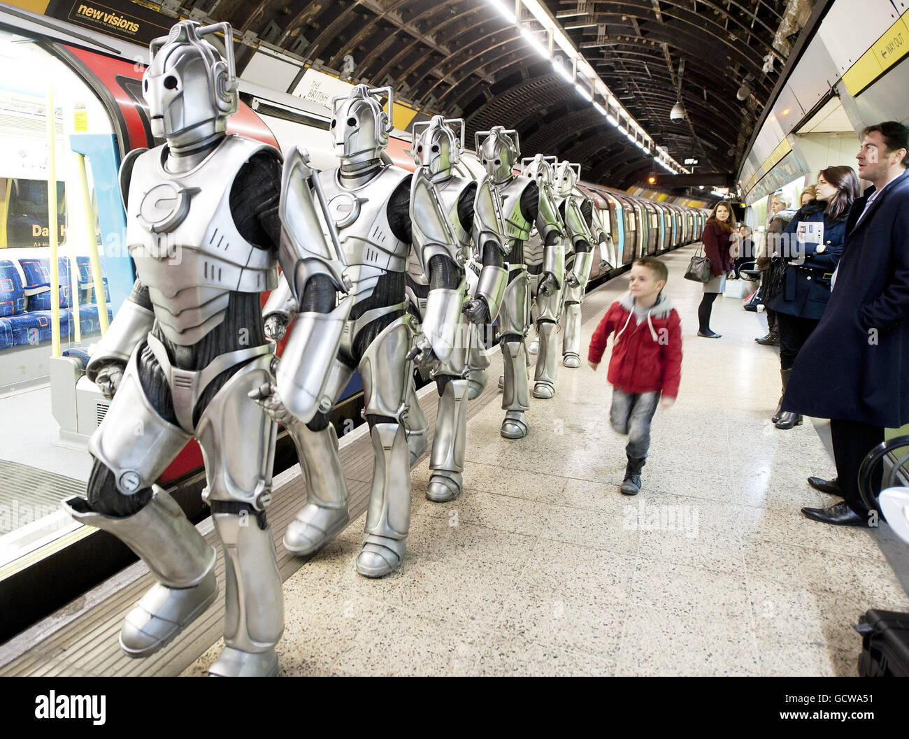 George David Craig, aged 6, runs beside a group of Cybermen as they ...