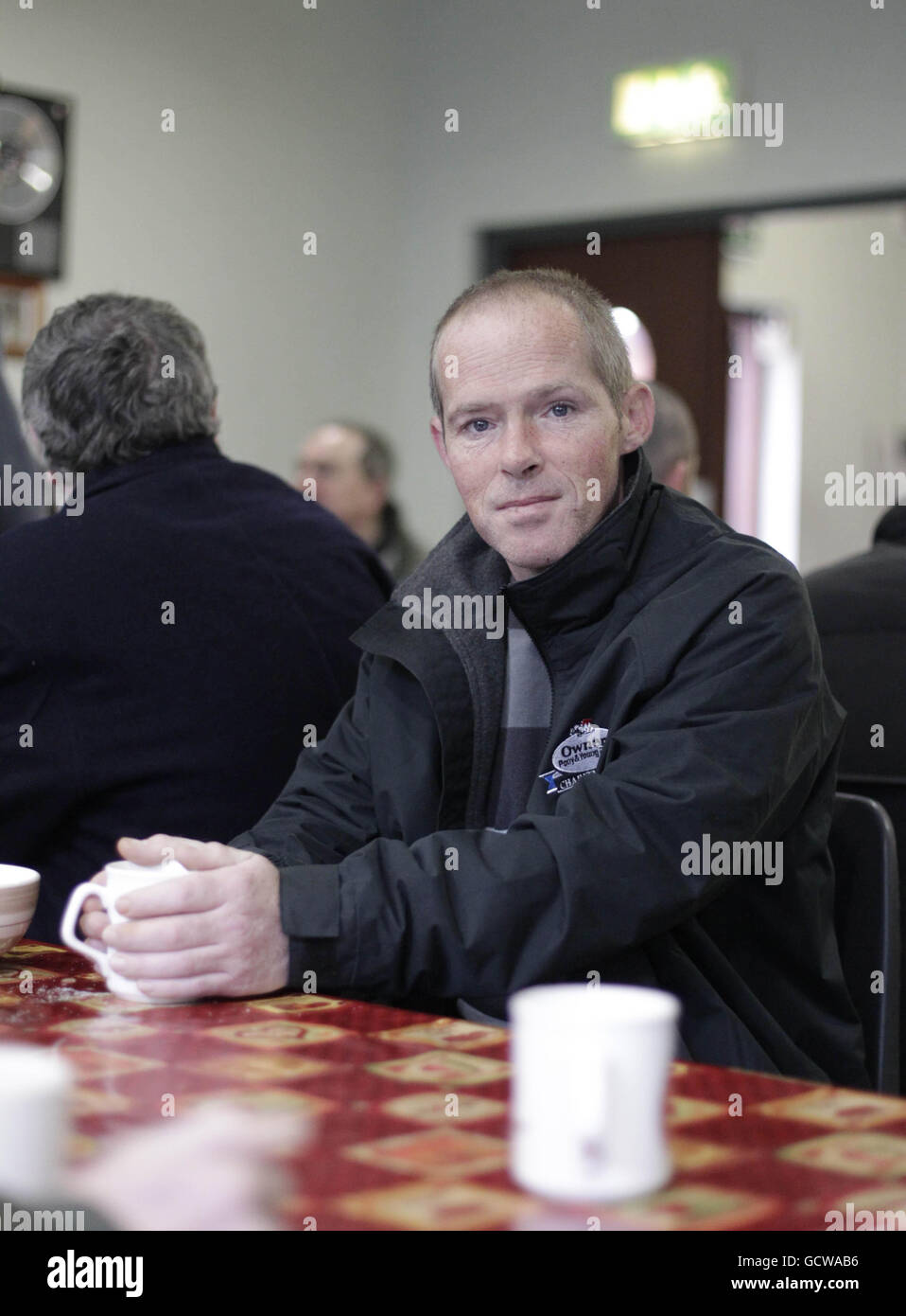 Homeless man Noel Fagan has a coffee after picking up a food parcel at ...