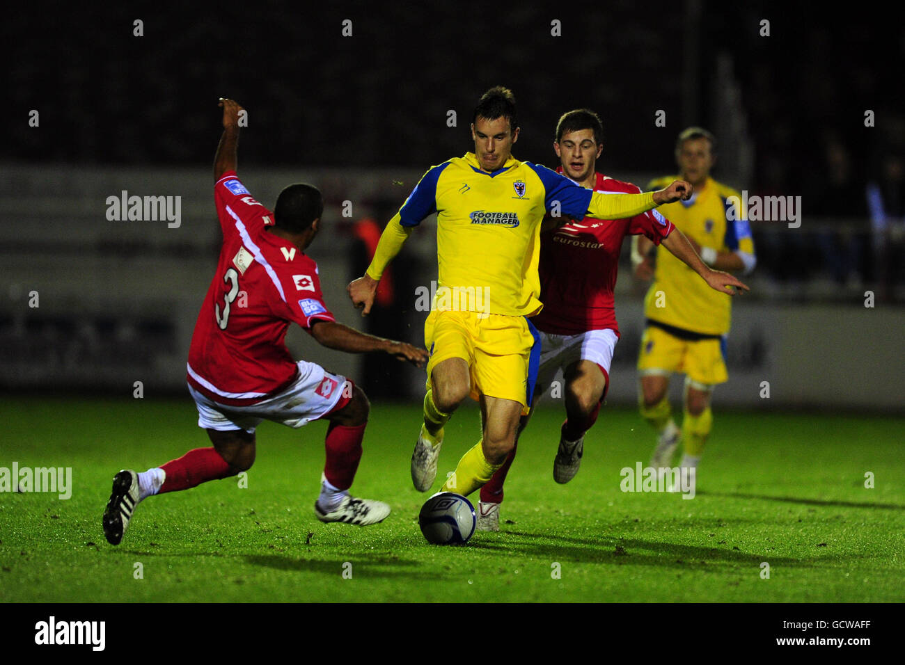 AFC Wimbledon's Steven Gregory (centre) battles Ebbsfleet United's ...