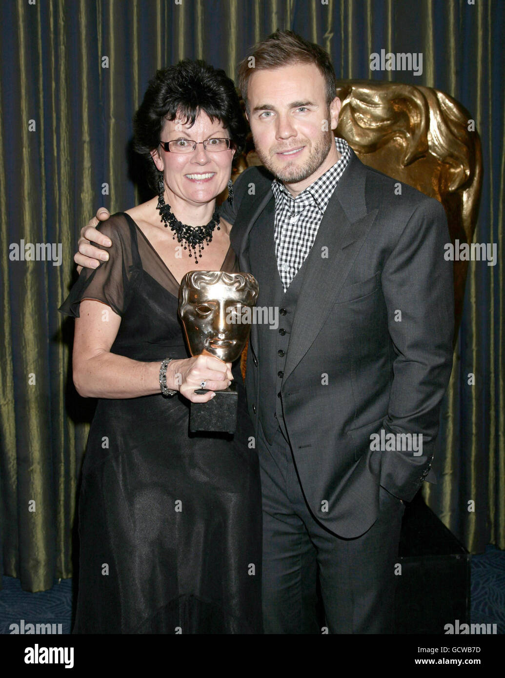 Gary Barlow presenting CBeebies Controller Kay Benbo with the Channel ...