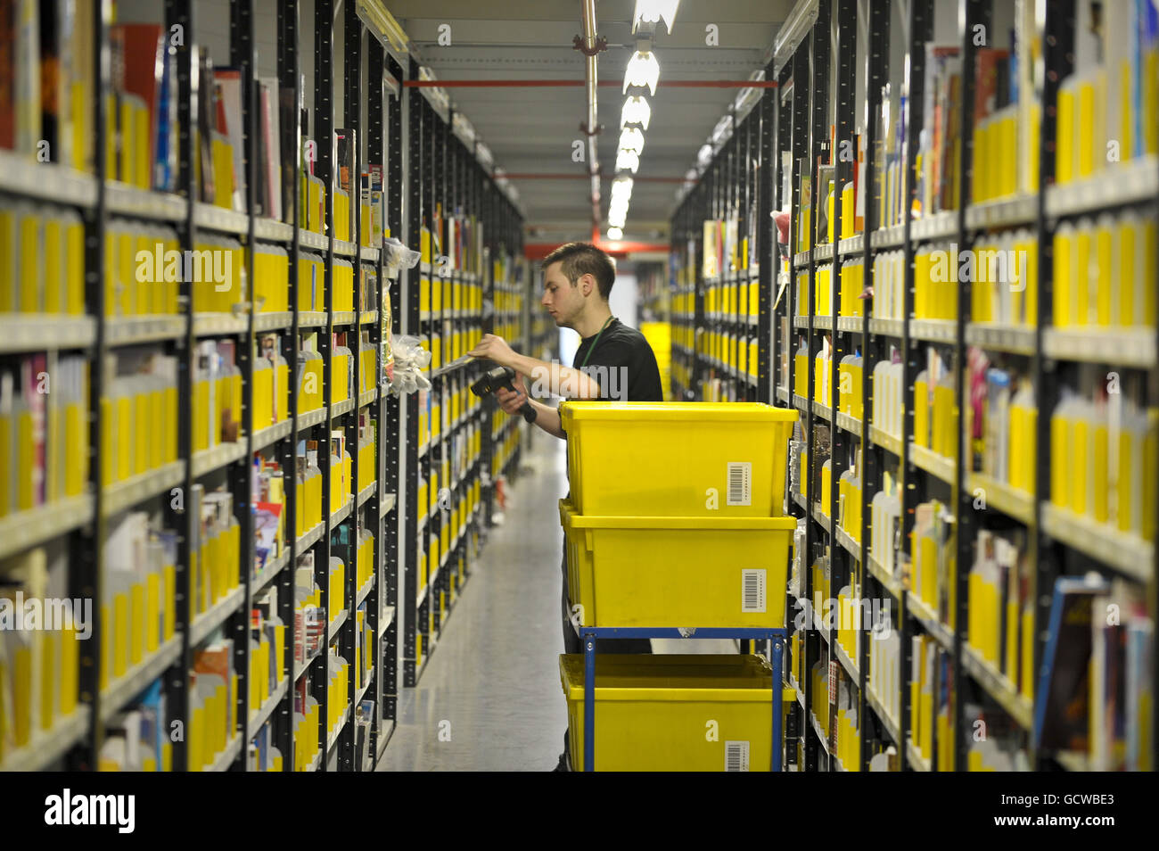 An amazon picks distributes books at the amazon distribution centre hi ...