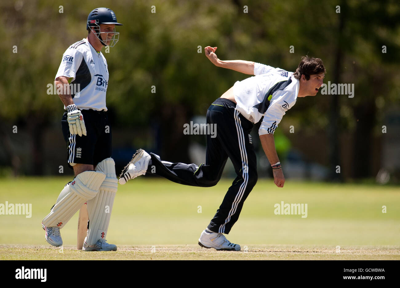 England's Steven Finn bowls watched by captain Andrew Strauss during ...