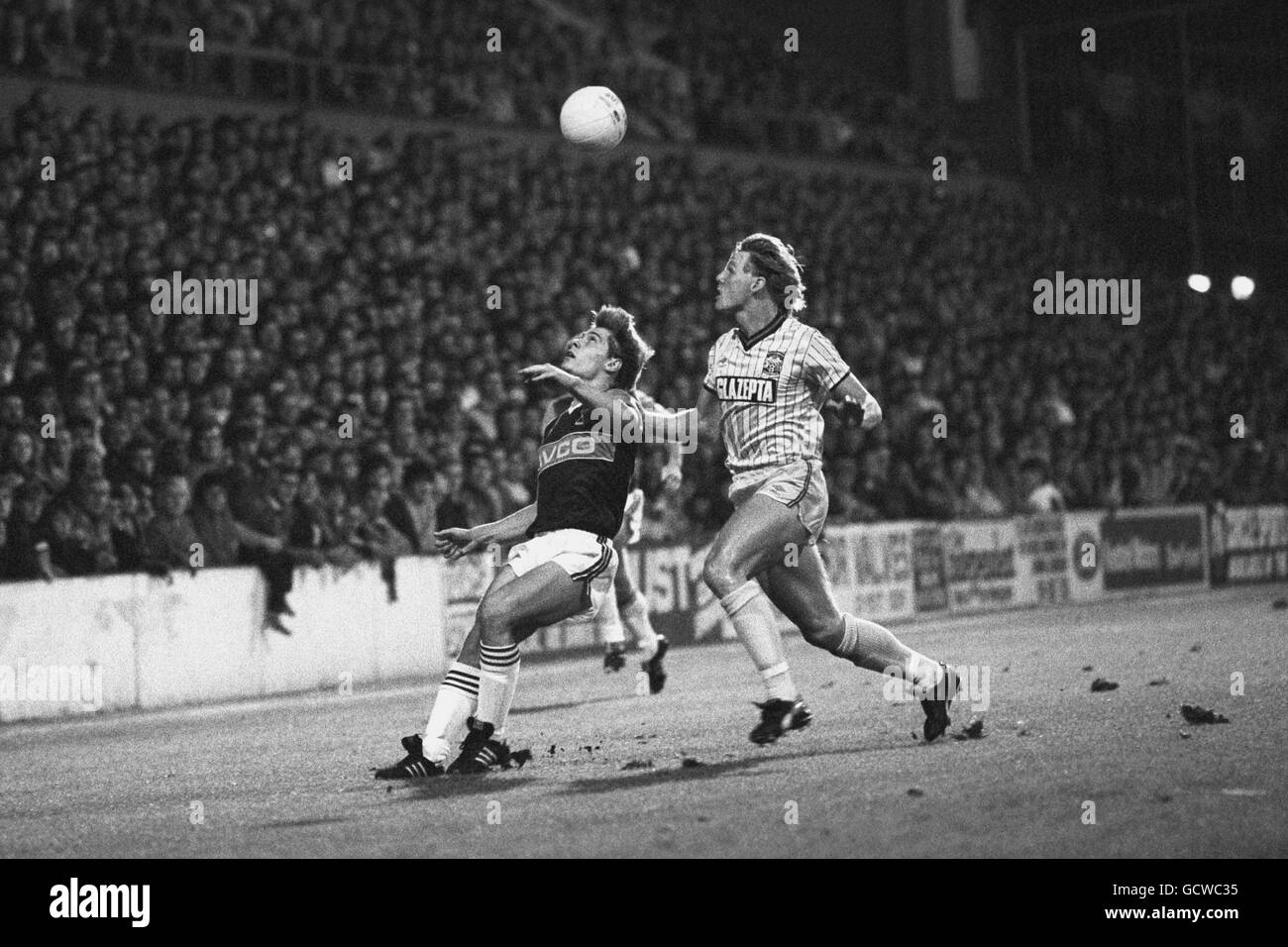 West Ham United's Tony Cottee and Coventry's Stuart Pearce, right, in ...