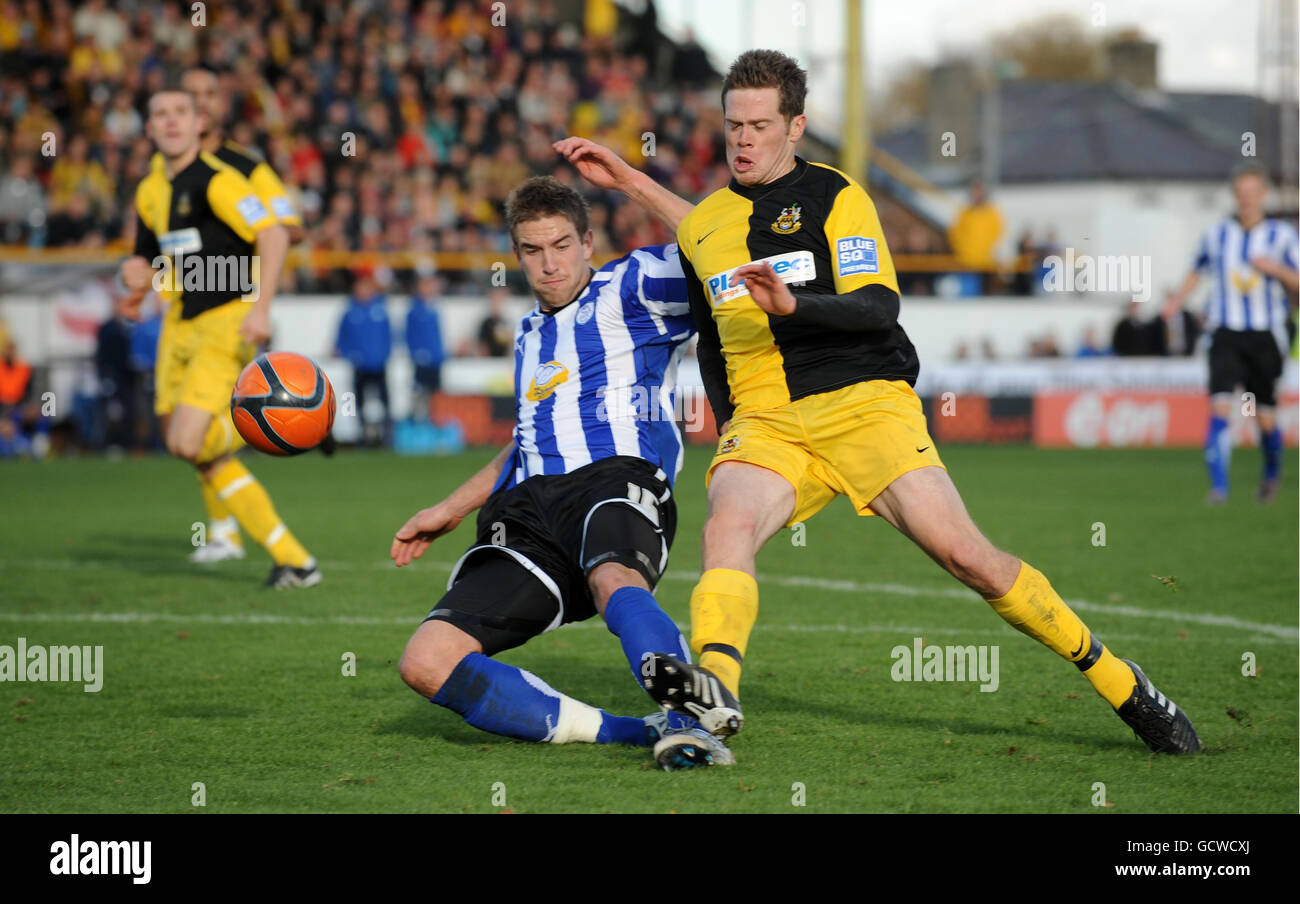 Southport's Paul Barratt (right) scores their first goal under pressure ...