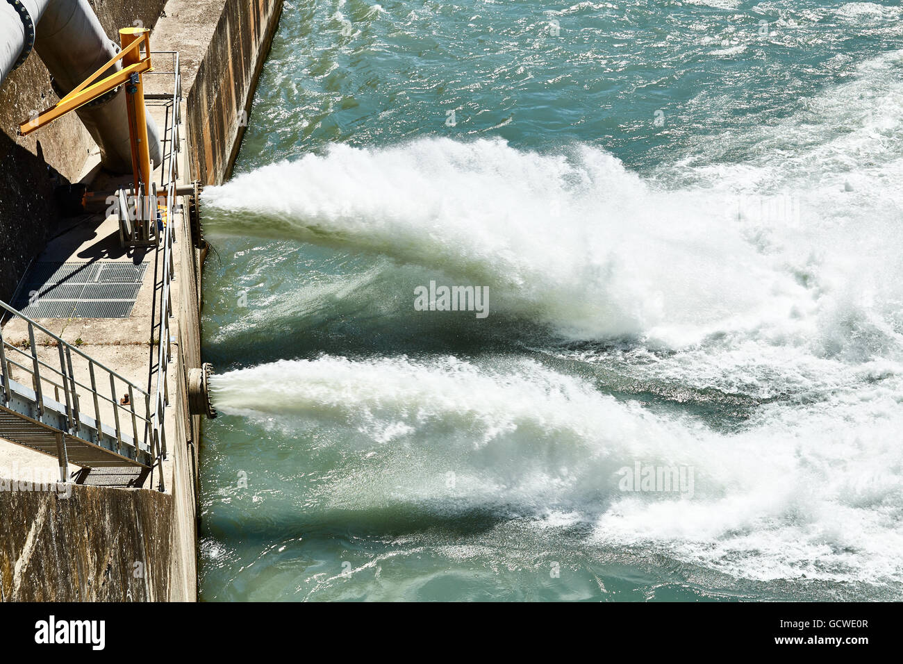 Discharge water from dam in the Alps Stock Photo - Alamy