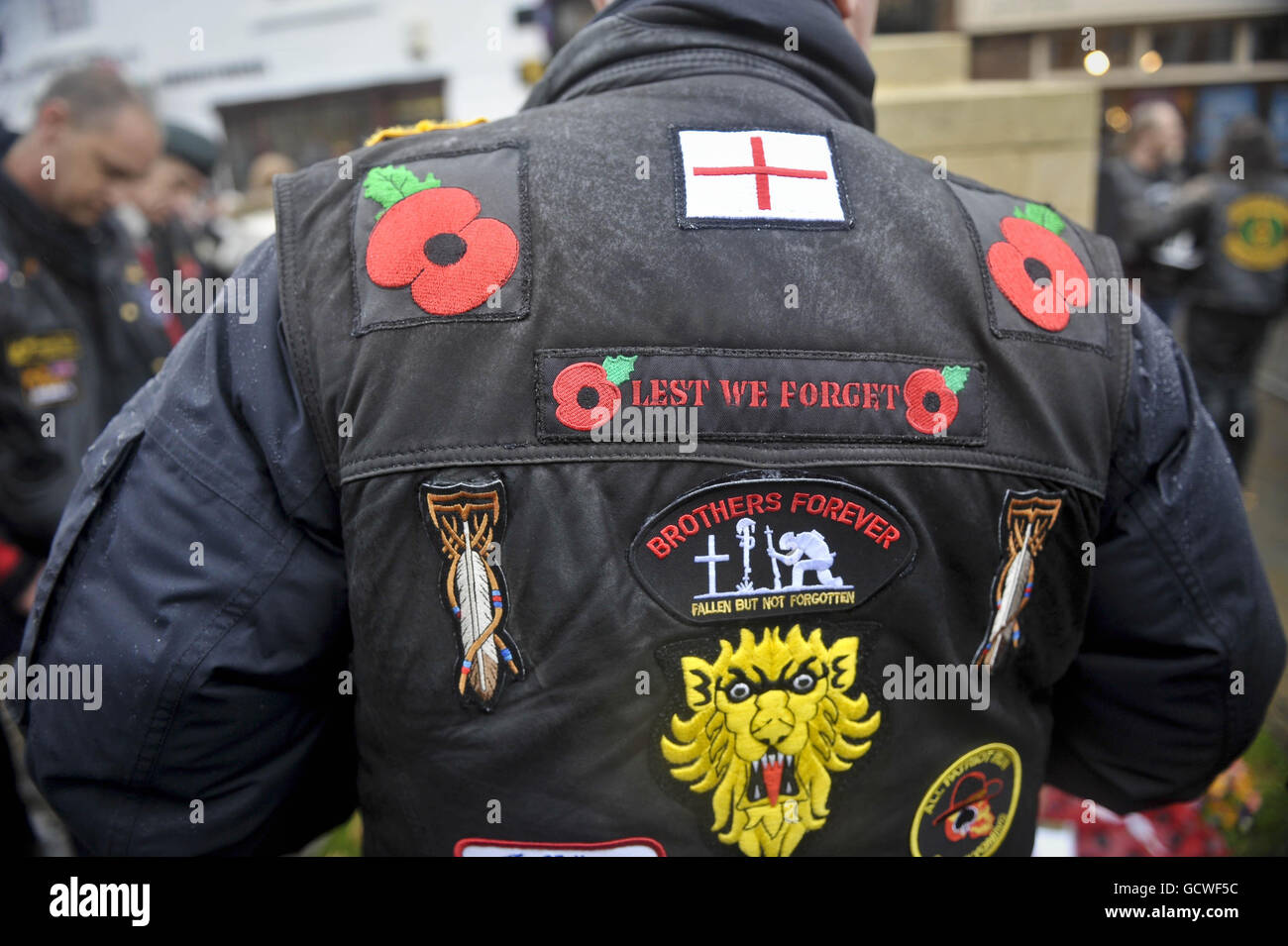 A man wears a waistcoat with millitary and remembrance patches during a ...