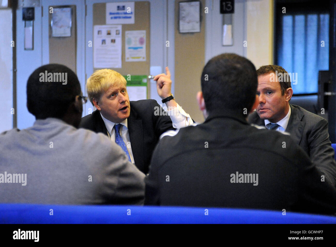 London Mayor Boris Johnson (centre left) and Policing and Criminal ...