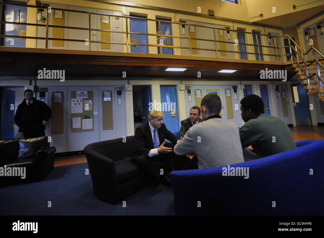 London Mayor Boris Johnson (left) speaks with young offenders during a ...