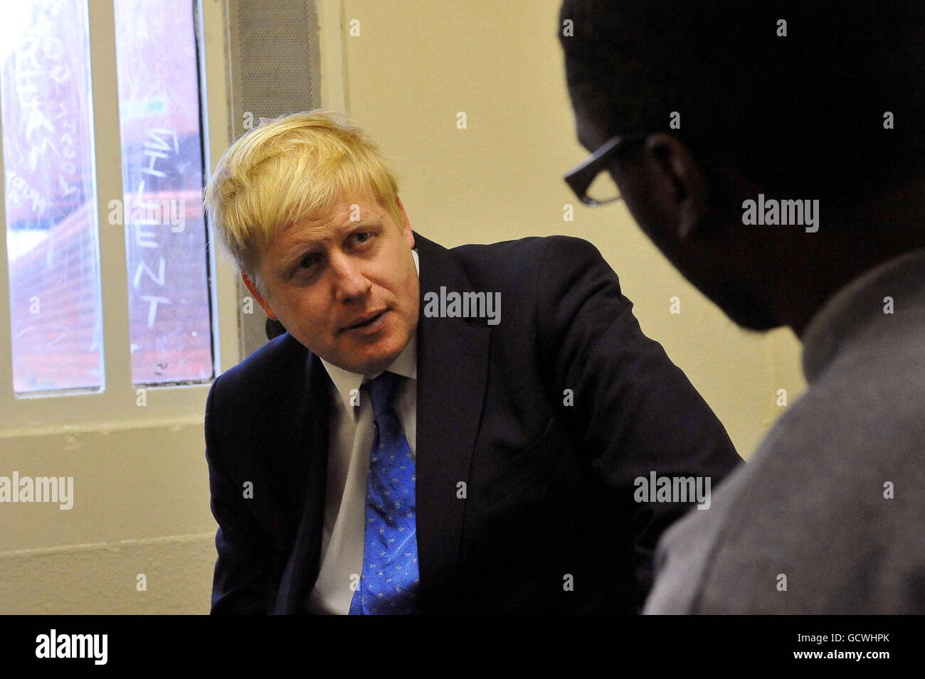 London Mayor Boris Johnson speaks with young offenders during a visit ...