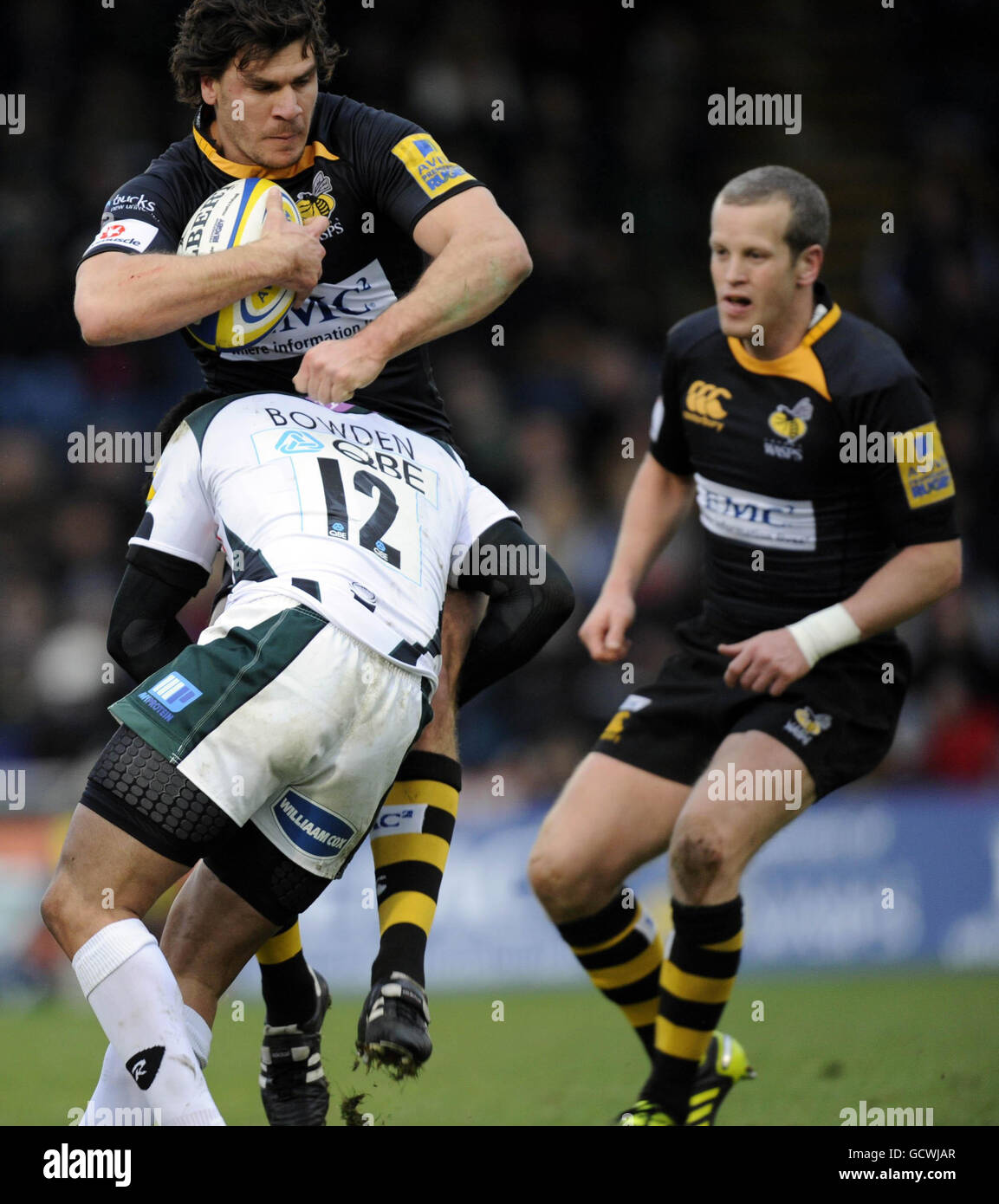 London Wasps' Ben Jacobs is tackled by London Irish's Daniel Bowden ...