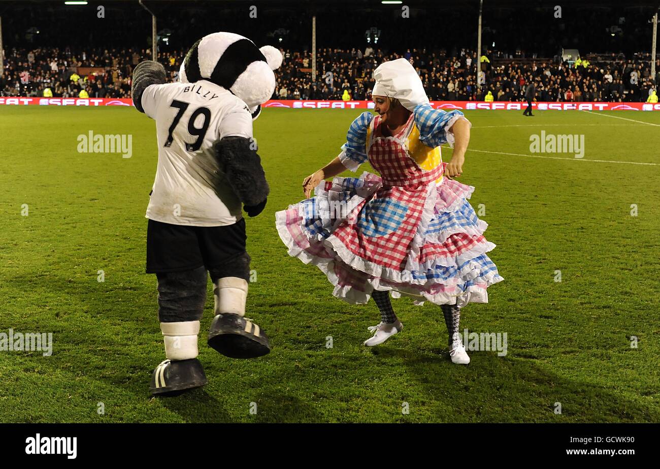 Fulham mascot Billy the Badger (left) dances with Pantomime Dame Sarah ...
