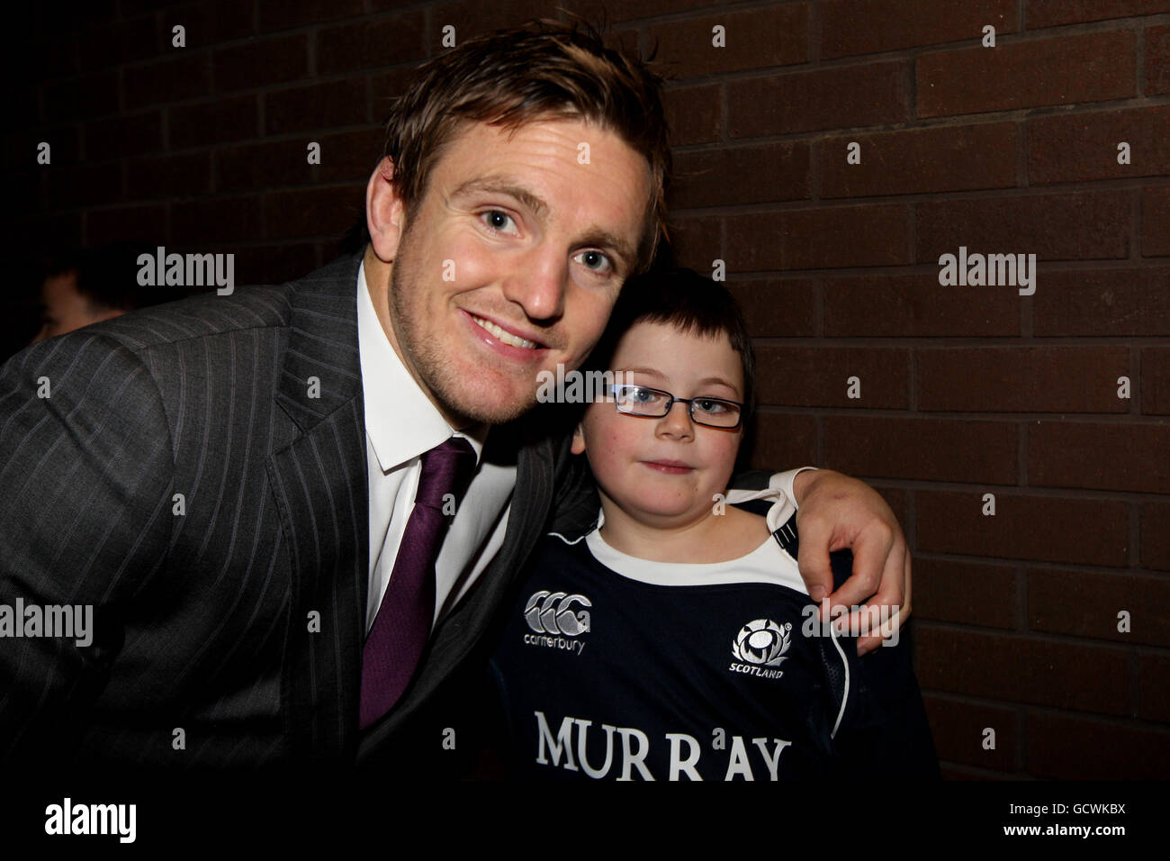 Scotland captain Rory Lawson poses for photographs after the match ...