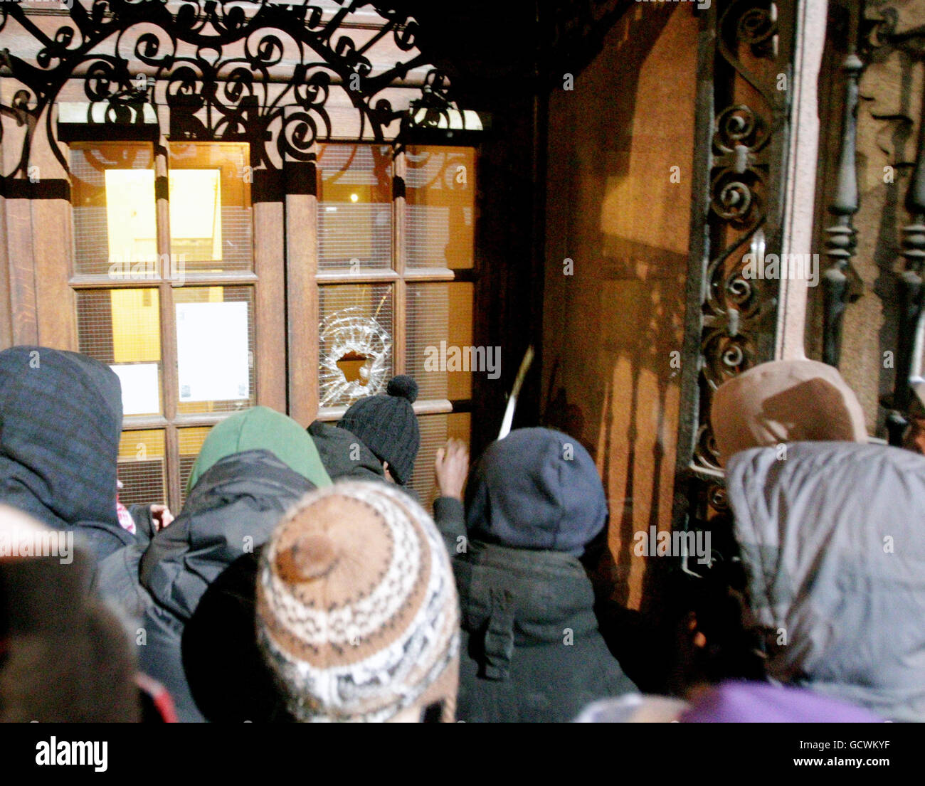 Protesters break window in the doors of building in whitehall hi-res ...