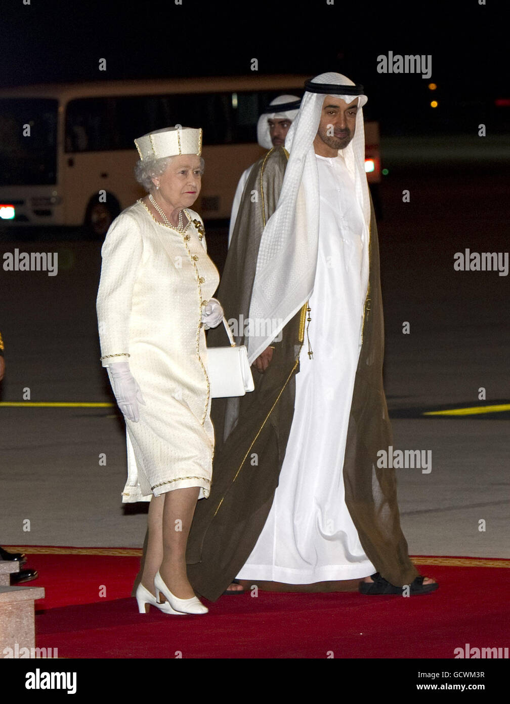 Queen Elizabeth II is greeted by Abu Dhabi Crown Prince Sheikh Mohammed bin Zayed Al Nahyan, as ...
