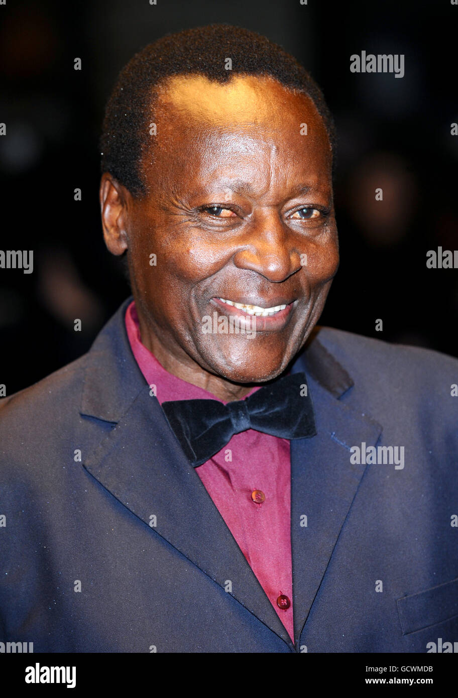 Oliver Litondo arrives at the premiere of The First Grader the Odeon ...