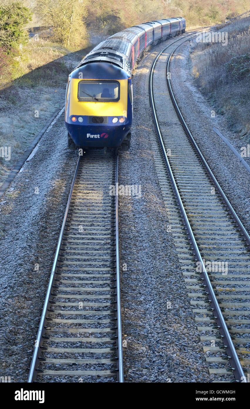 A train travels to London along the Great Western Railway line on the ...