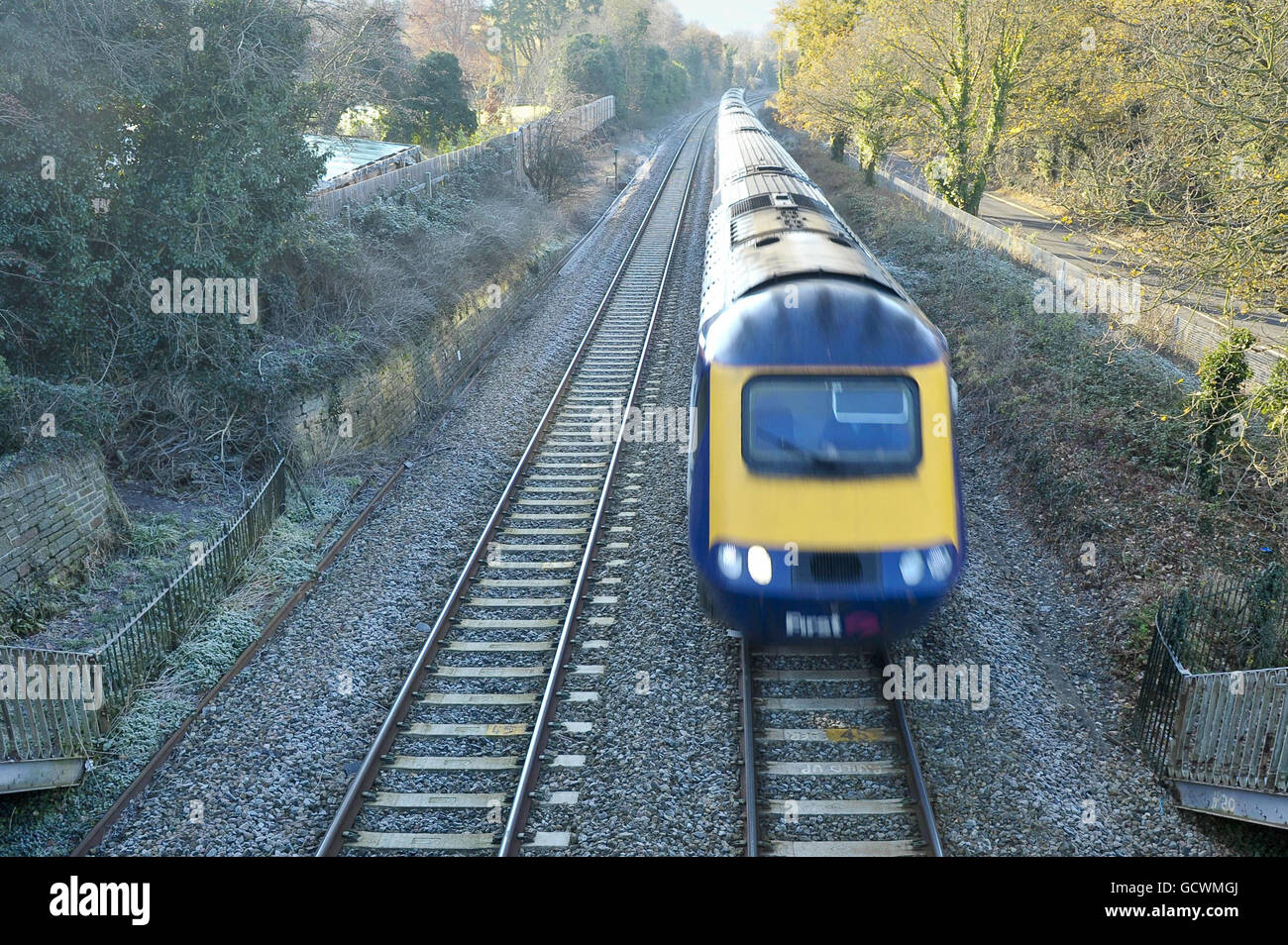 A train travels to London along the Great Western Railway line on the ...