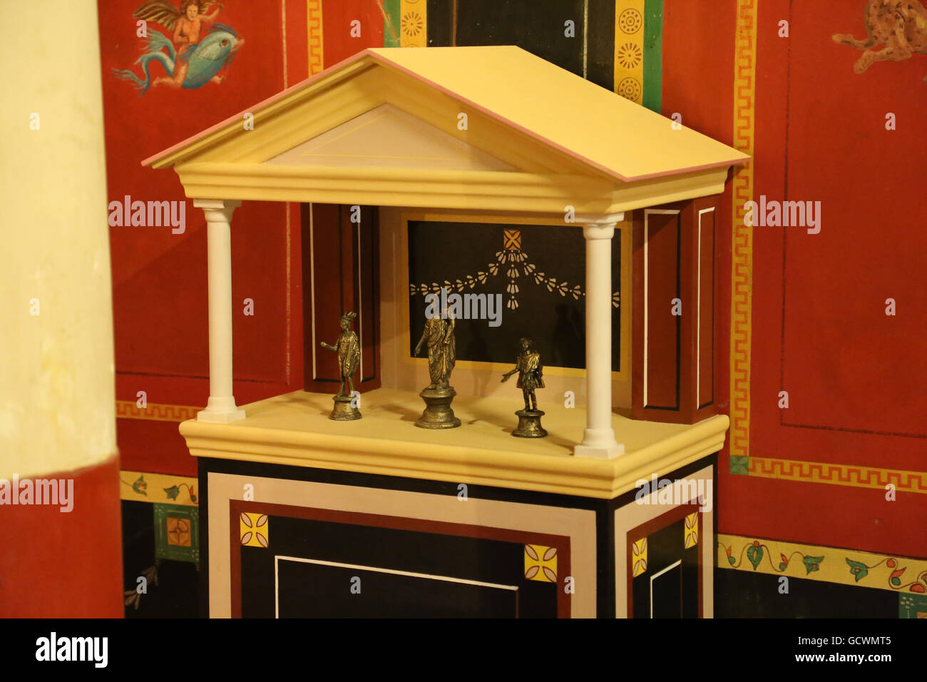 A modern replica of a lararium in the reconstructed room of Domus ...