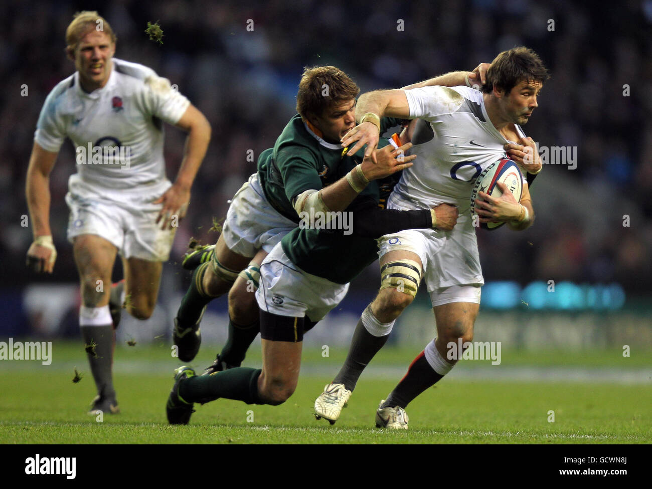 England's Ben Foden is tackled by South Africa's Juan Smith and Ruan ...