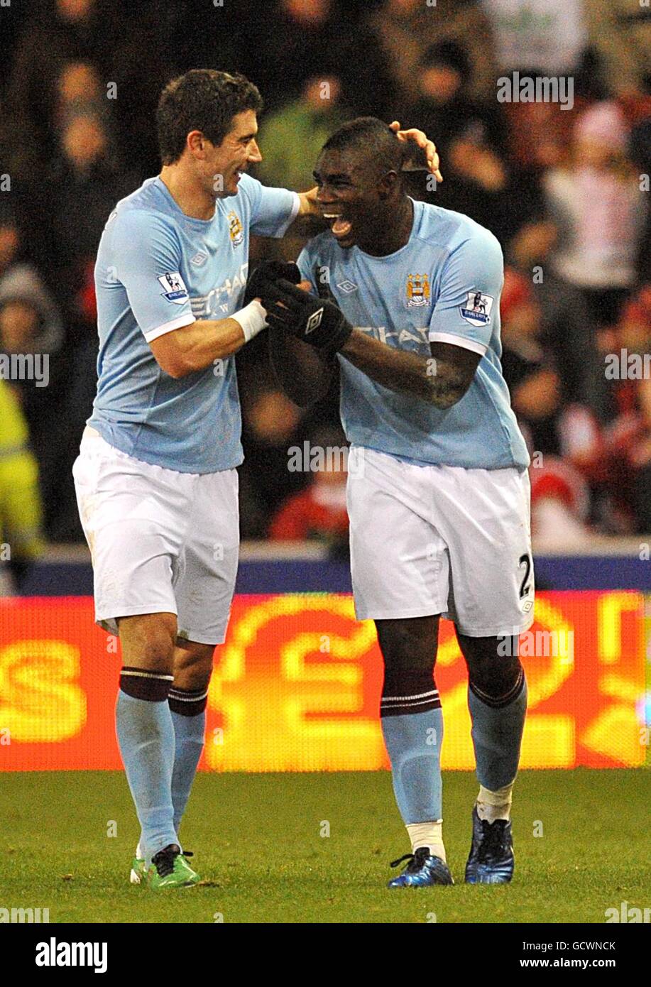 Manchester City's Micah Richards (right) celebrates scoring his sides ...