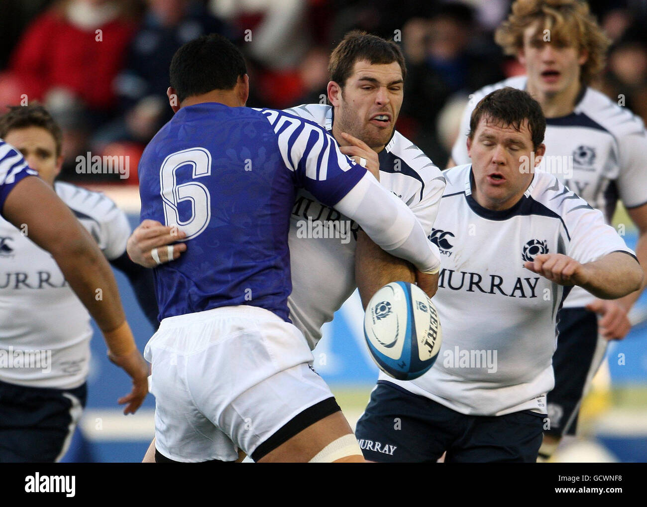 Scotland's Sean Lamont and Allan Jacobsen in action with Samoa's Ofisa ...