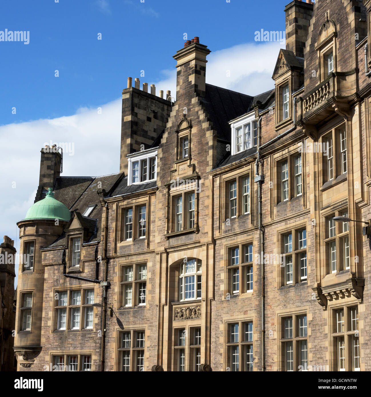 A large building with brown stone facade and many windows; Edinburgh ...