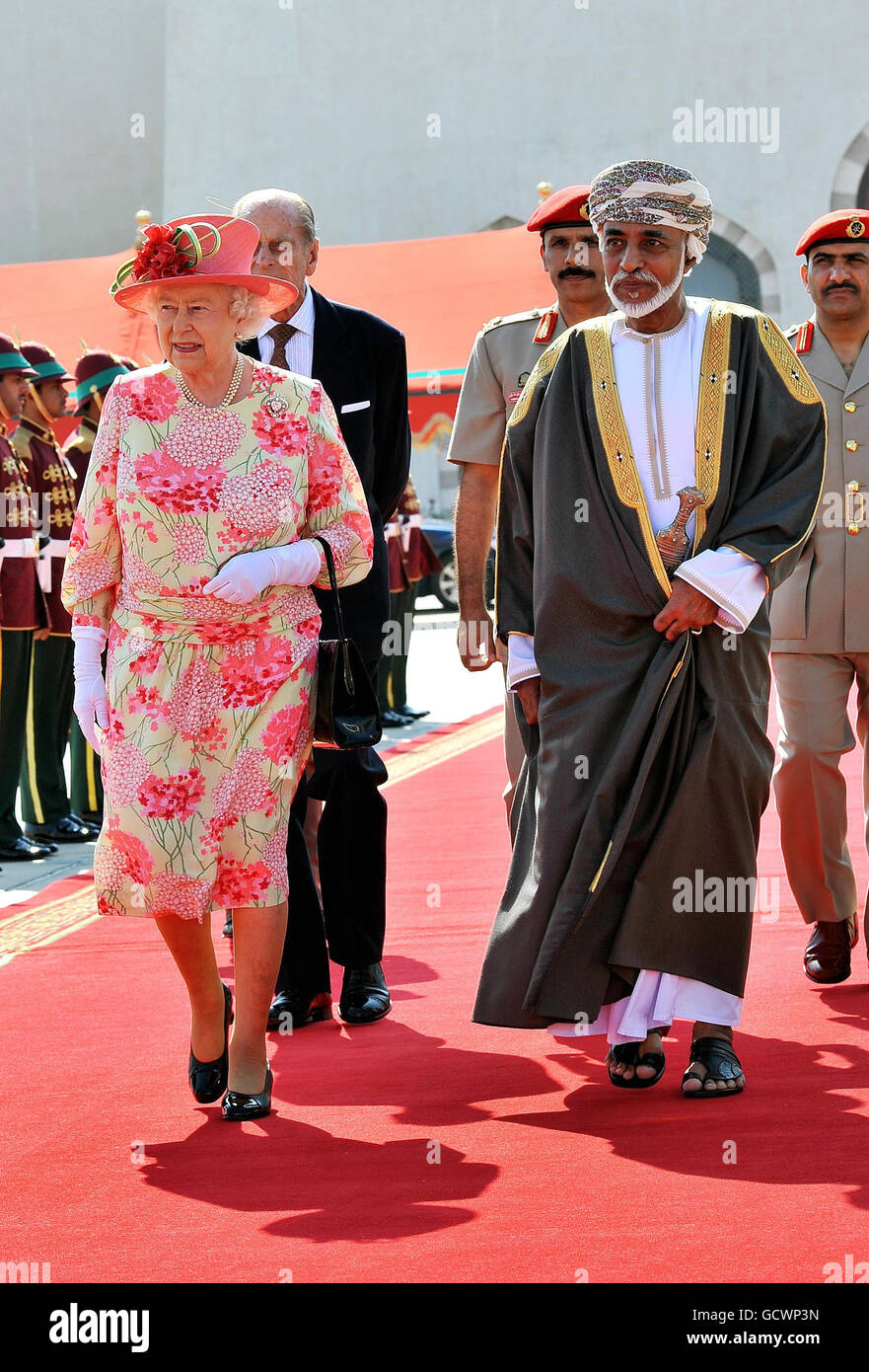 Queen Elizabeth II walks towards her plane with the Sultan of Oman, His ...