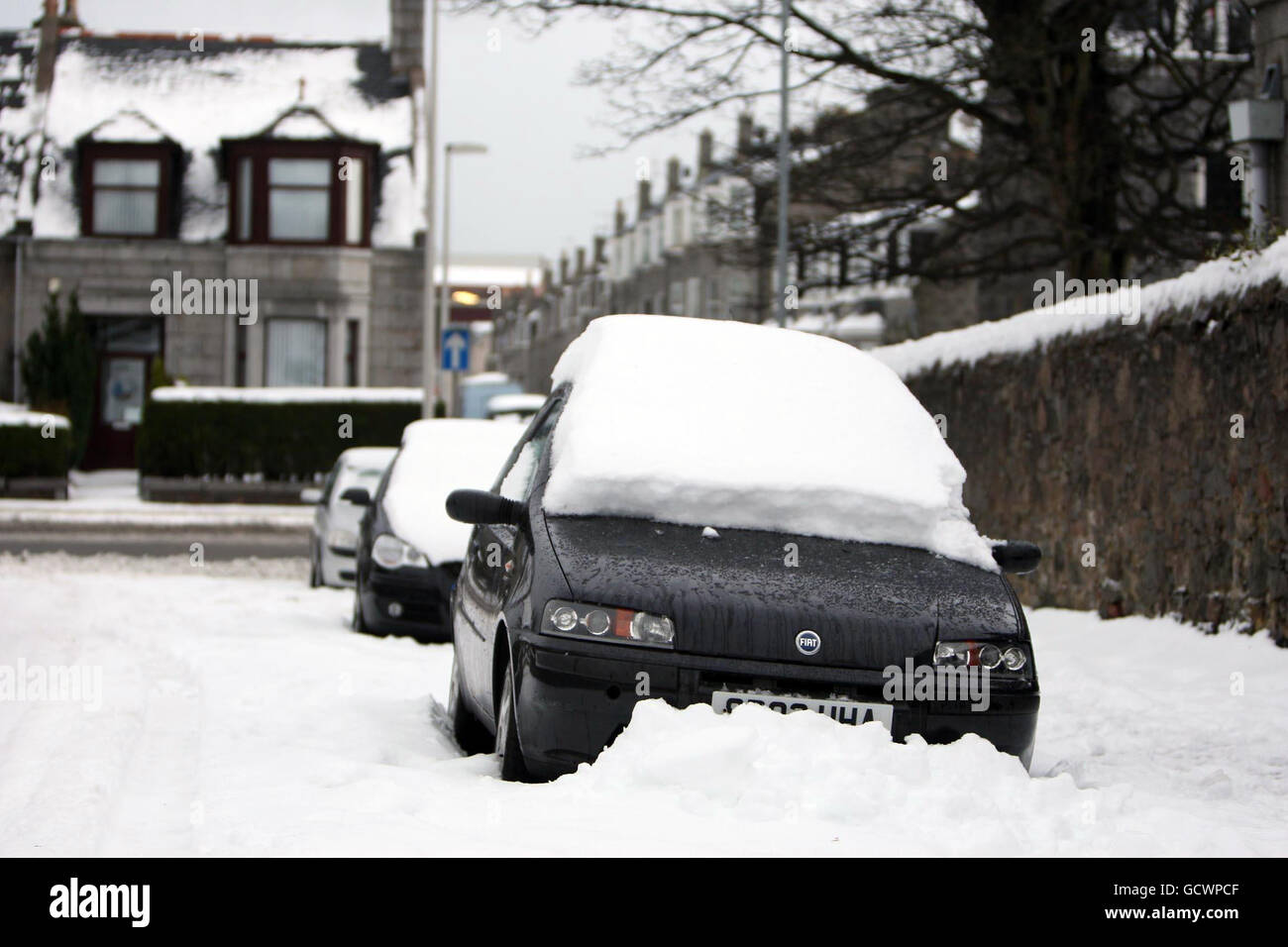 Cars in the snowy conditions in Aberdeen as the cold snap hitting the ...