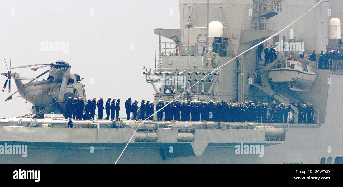 Crew aboard HMS Ark Royal as it sails into Portsmouth for the final ...