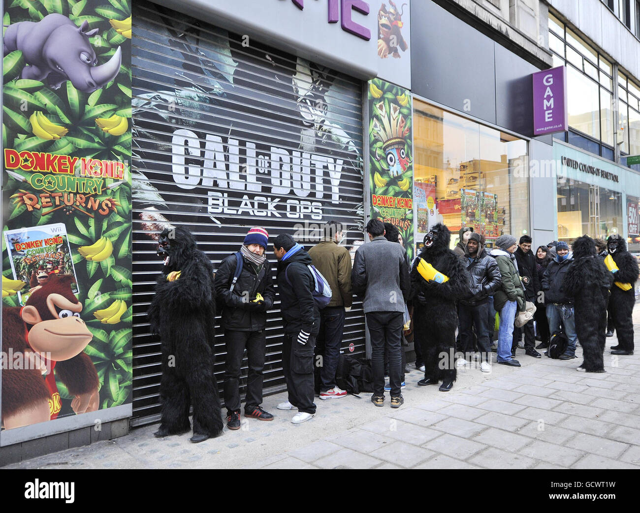 People queue outside the GAME store on London's Oxford Street to be the ...