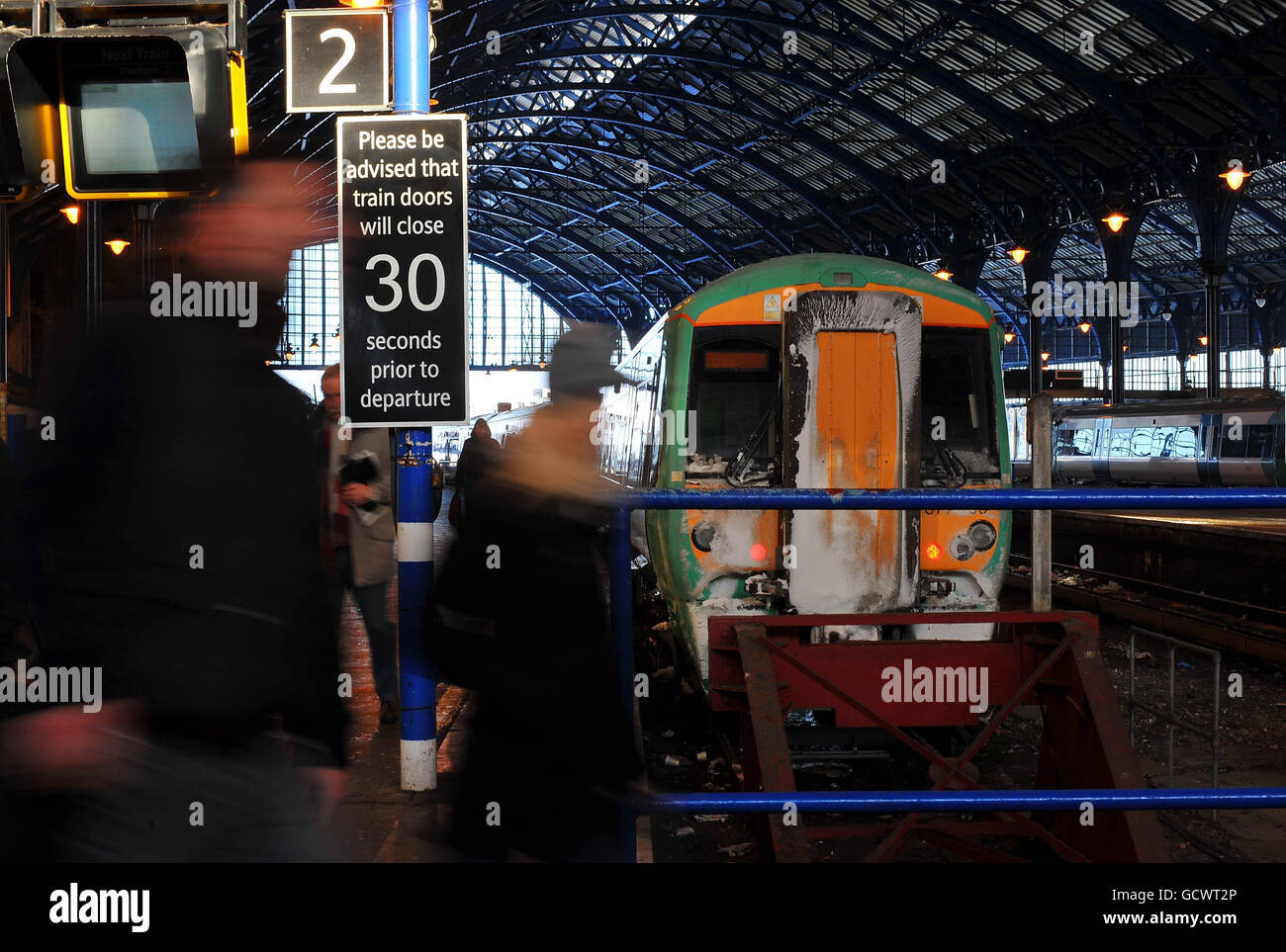 Passengers walk past a Southern train at Brighton station as Brighton ...