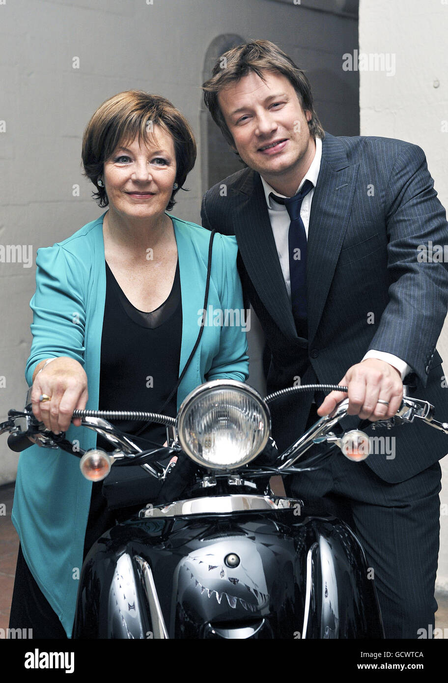 Chefs Jamie Oliver and Delia Smith sit on a scooter to be raffled for ...