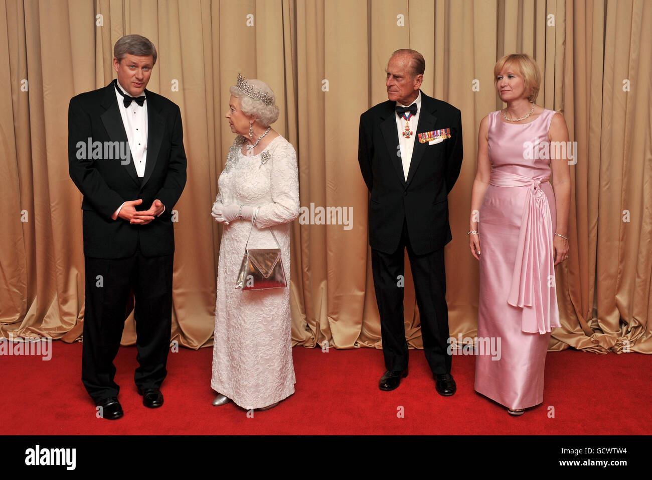 Queen Elizabeth II waits with Canadian PM Stephen Harper (left), the ...