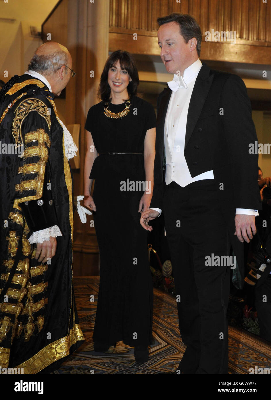 Prime Minister David Cameron (right) and his wife Samantha Cameron are ...