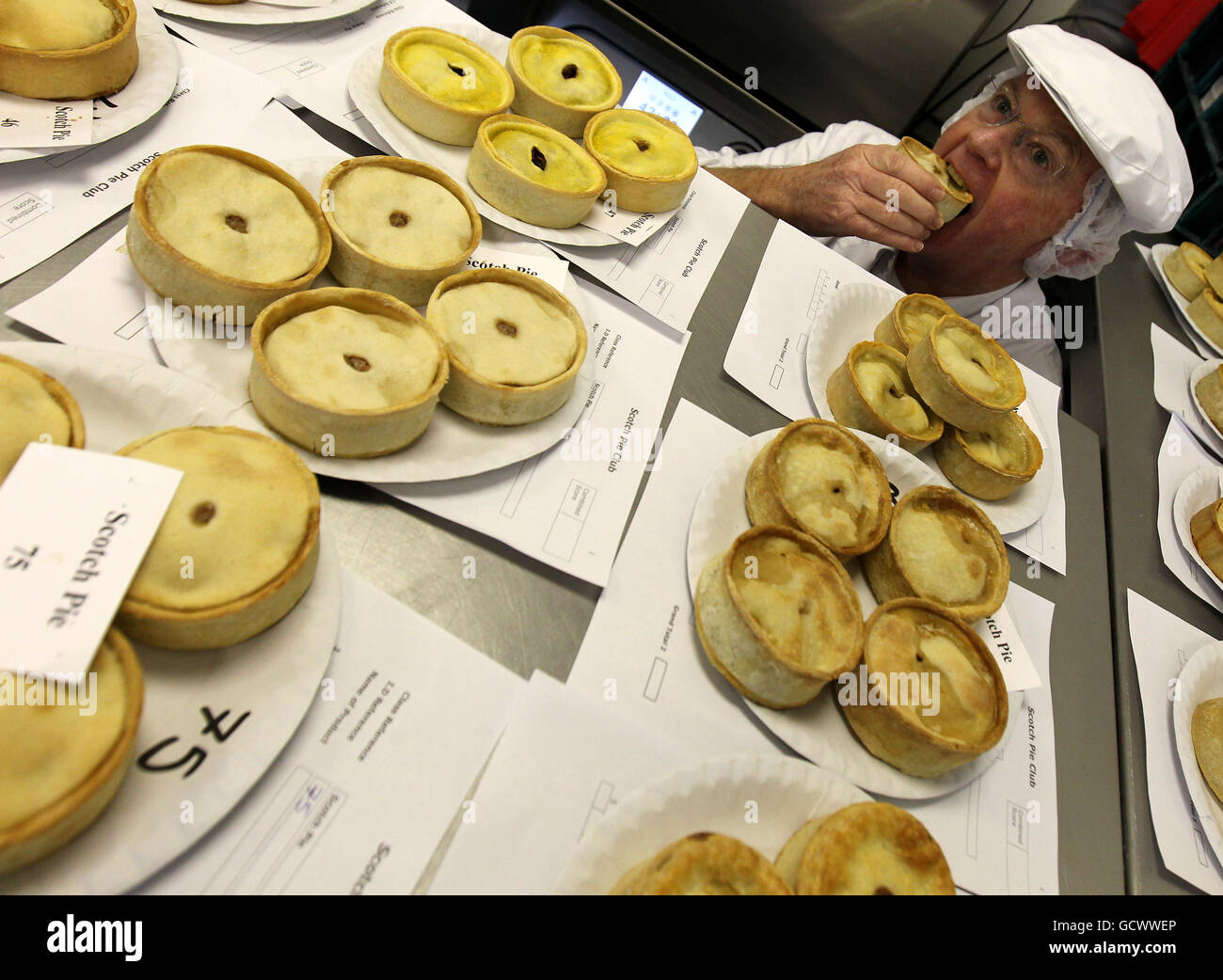 Chief judge Robert Ross tastes a pie during the World Scotch Pie ...