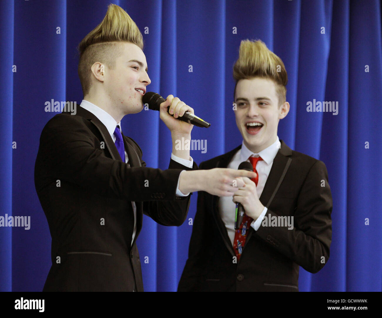 John (blue tie) and Edward Grimes aka Jedward speak with pupils from ...