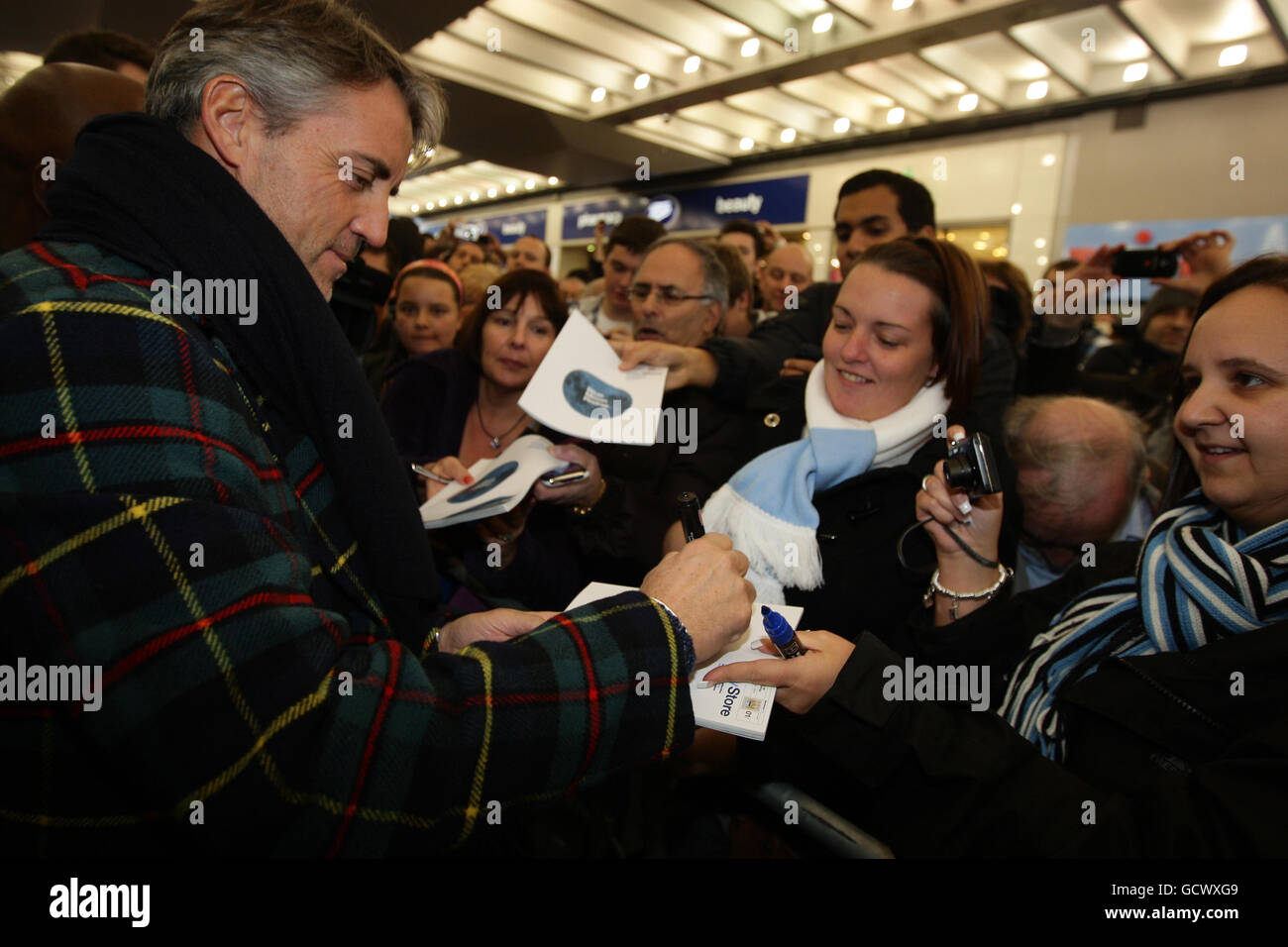 Soccer roberto mancini opens new manchester city store arndale centre ...