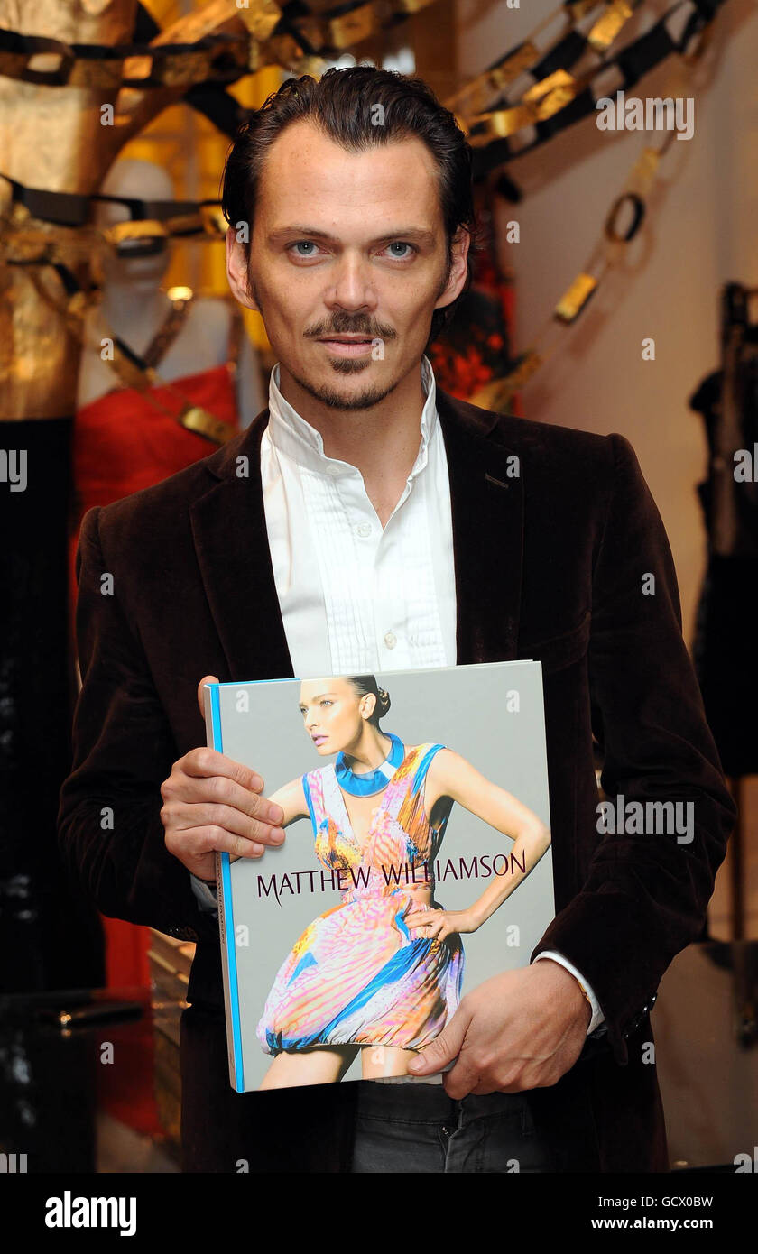 Designer Matthew Williamson poses ahead of a signing session for his ...