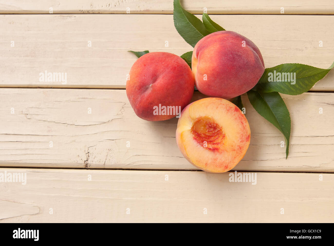 Freshly picked organic peaches with leaves from tree - top view Stock ...