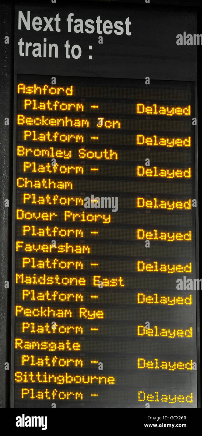 An information board displays delayed trains at Victoria Station in ...