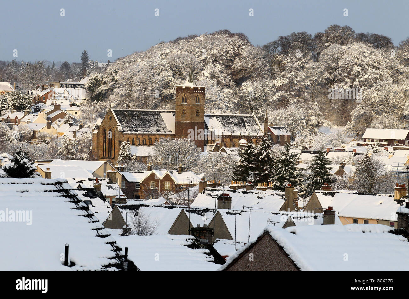 A general view of snow covered rooftops in Dunblane, with the Cathedral ...