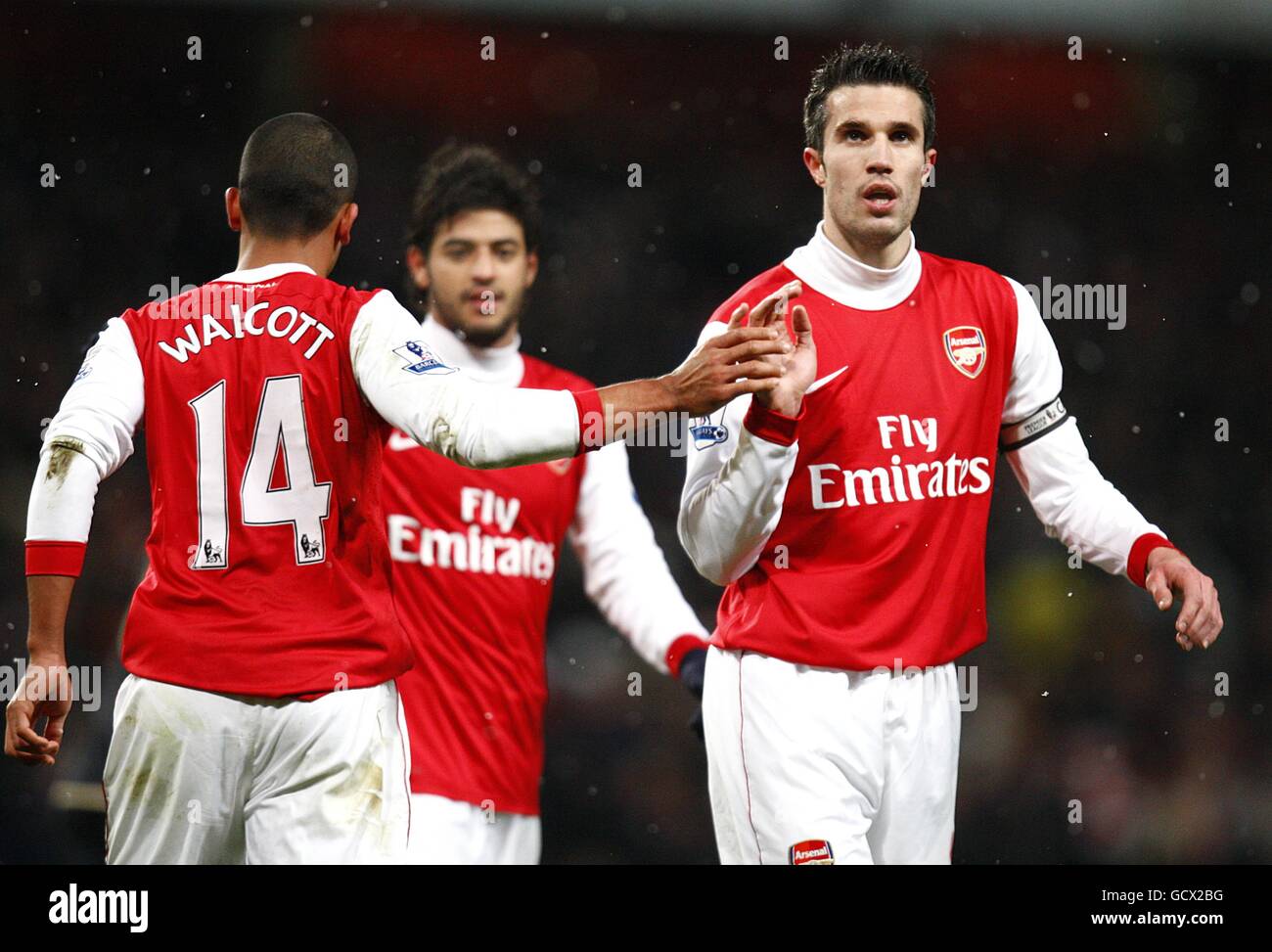 Arsenal's Robin van Persie (right) and Theo Walcott (left) celebrate ...