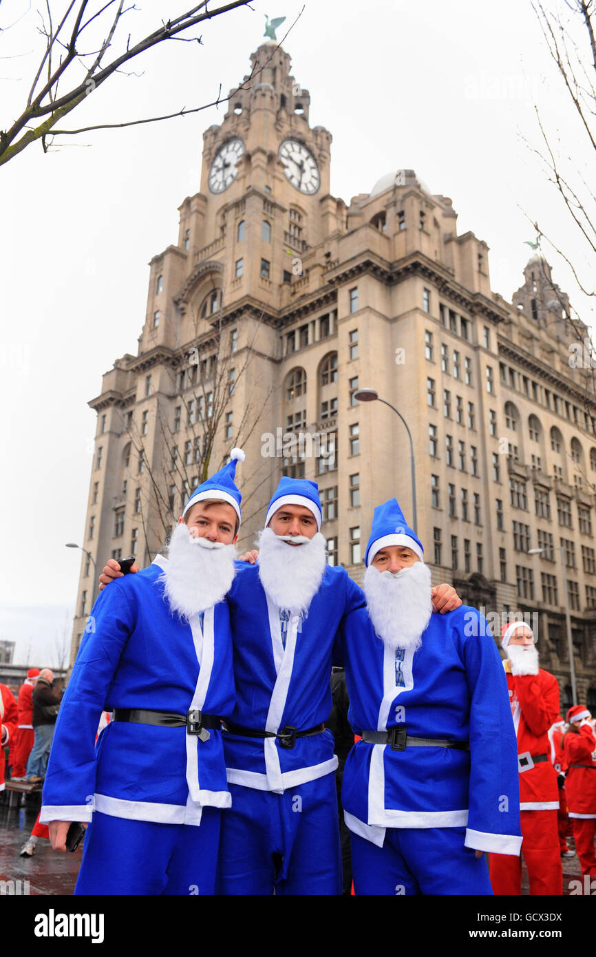 Blue Santa's pose for a photograph prior to the annual 5km Liverpool ...