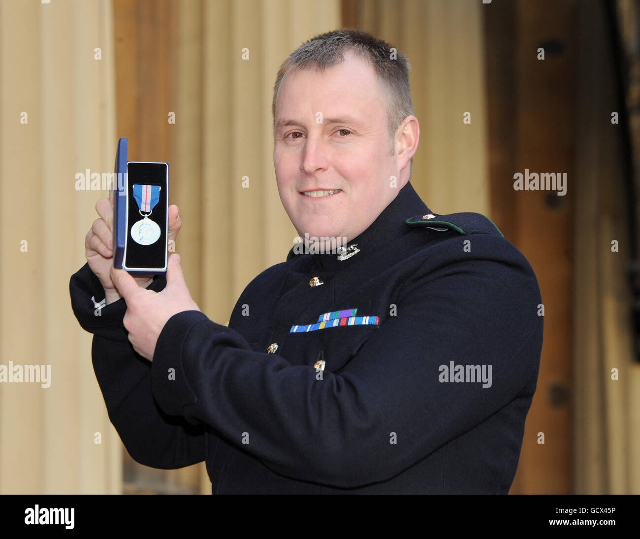 Corporal John Hardman poses for media after being presented with the ...
