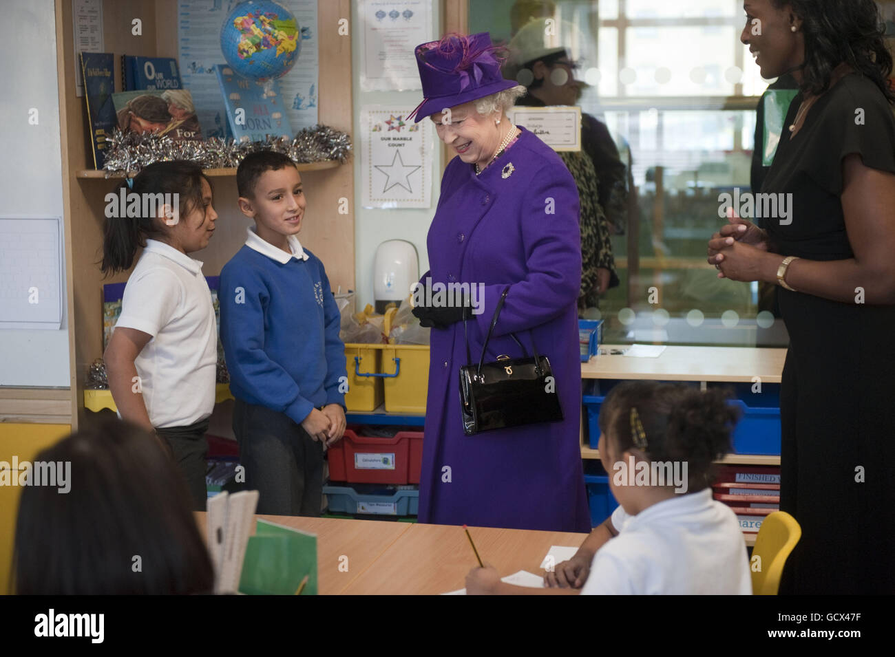 Queen Elizabeth II with Sheila McCalla-Gordon (right) the Executive ...
