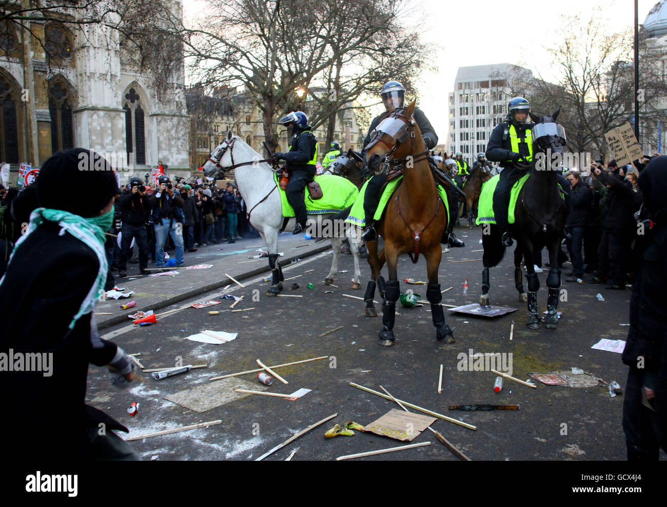 Demonstrators and mounted police face each other, as students ...